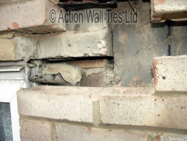 Concrete boot lintel repairs to London flats using stainless steel pins.